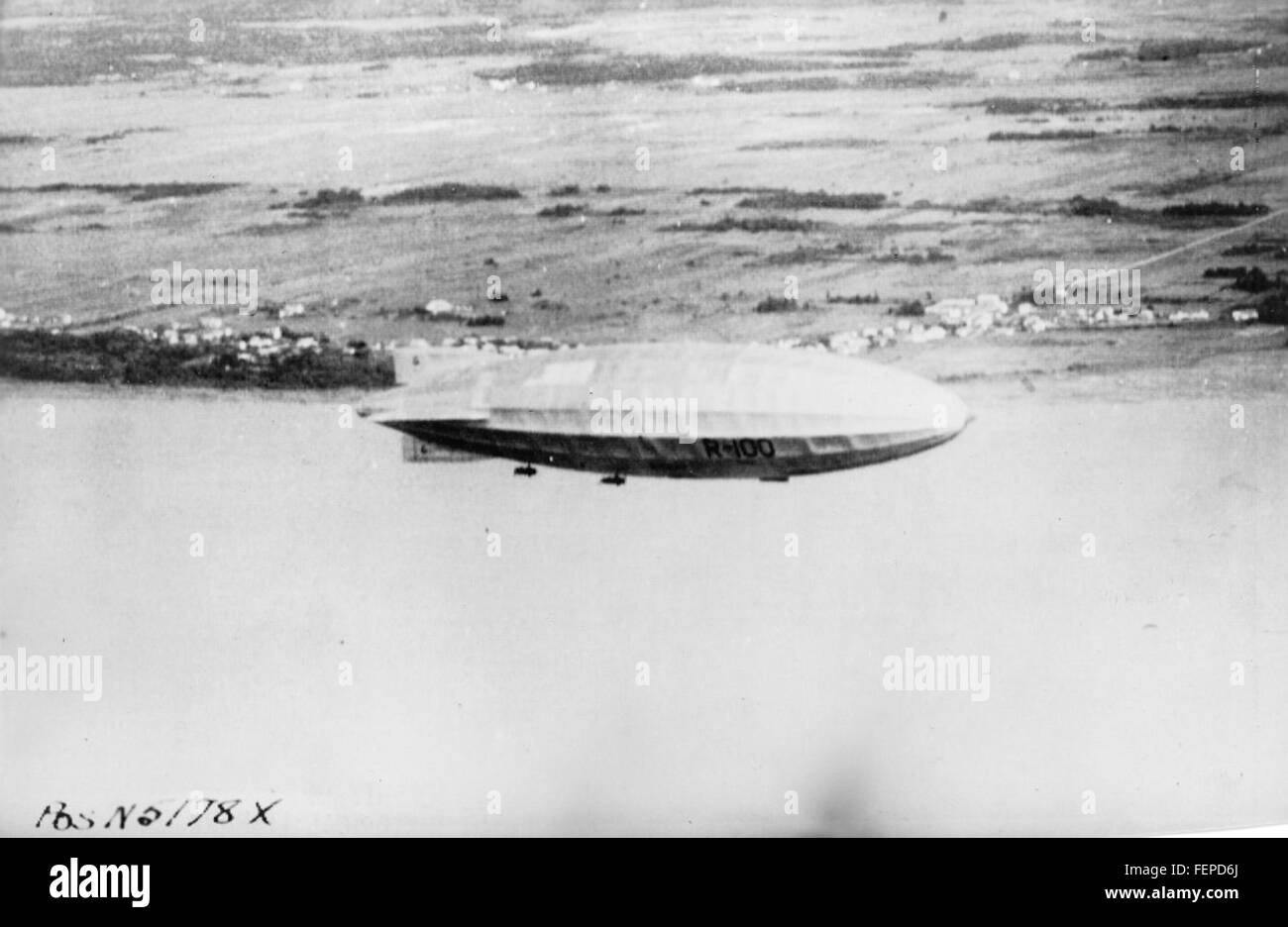 The R-100, a British rigid airship, is seen over the St. Lawrence River ...
