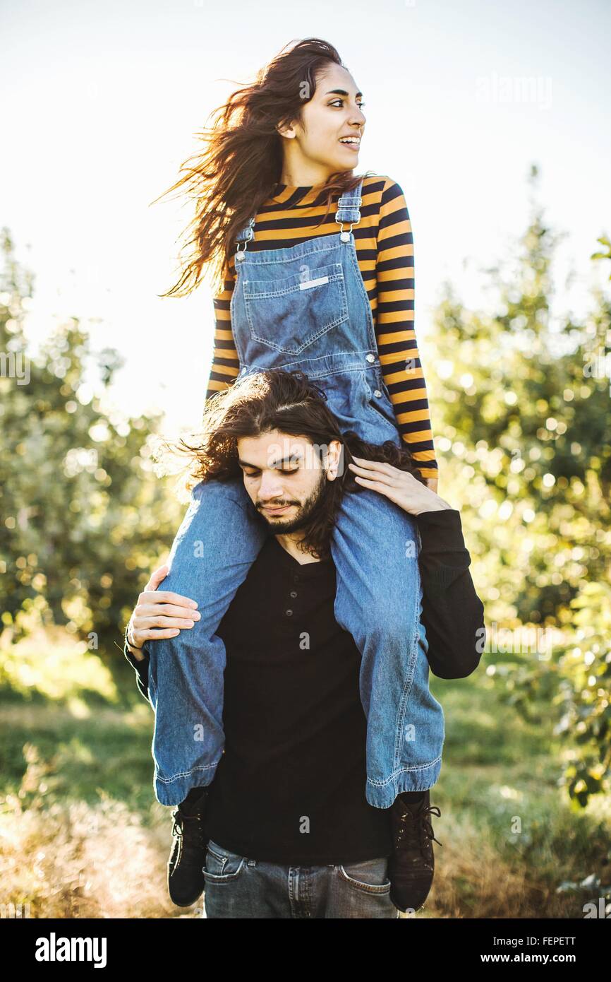 Woman on mans shoulders hi-res stock photography and images - Alamy