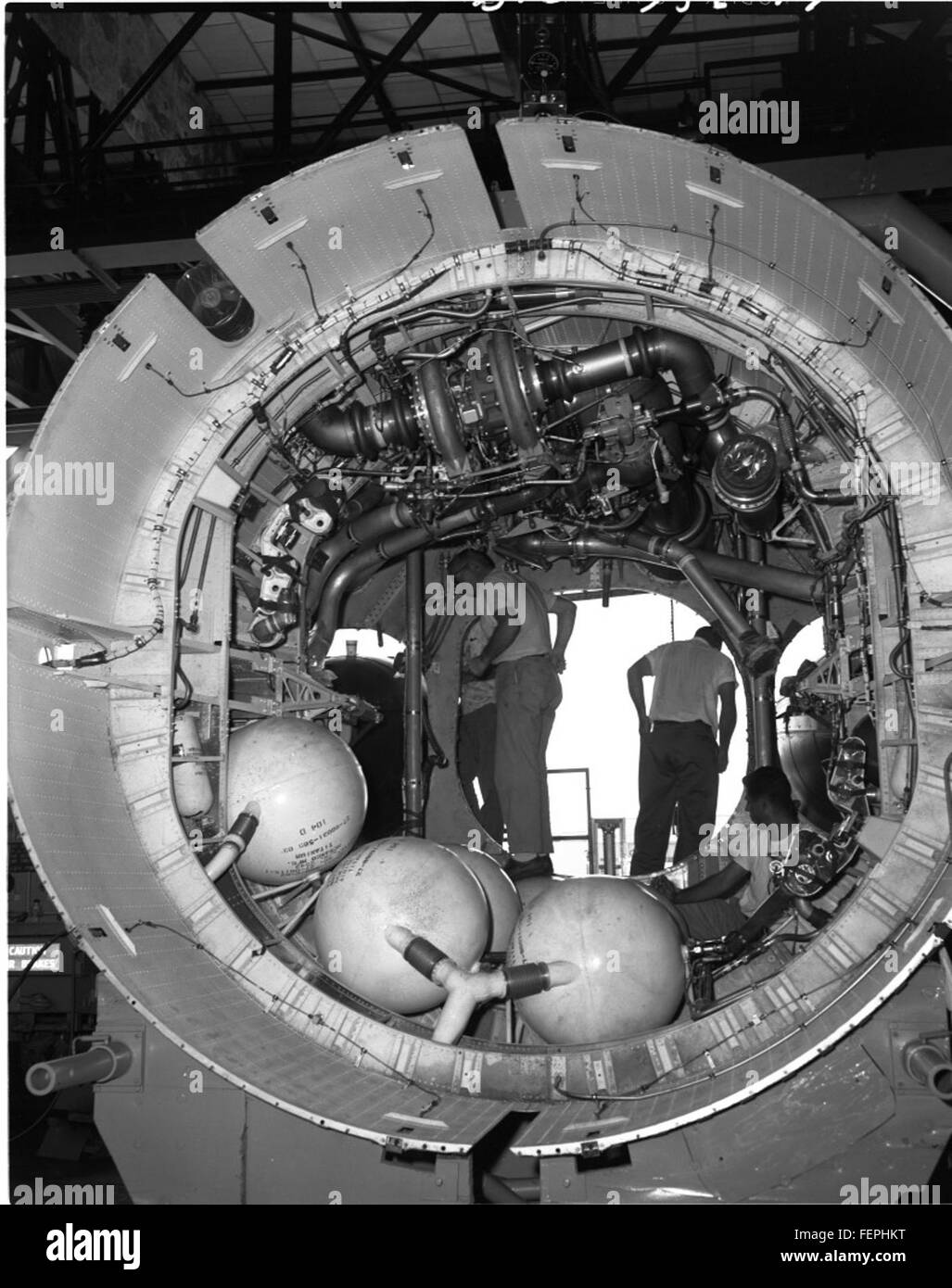 This detailed image showcases the plumbing and wiring of Missile 104 ...