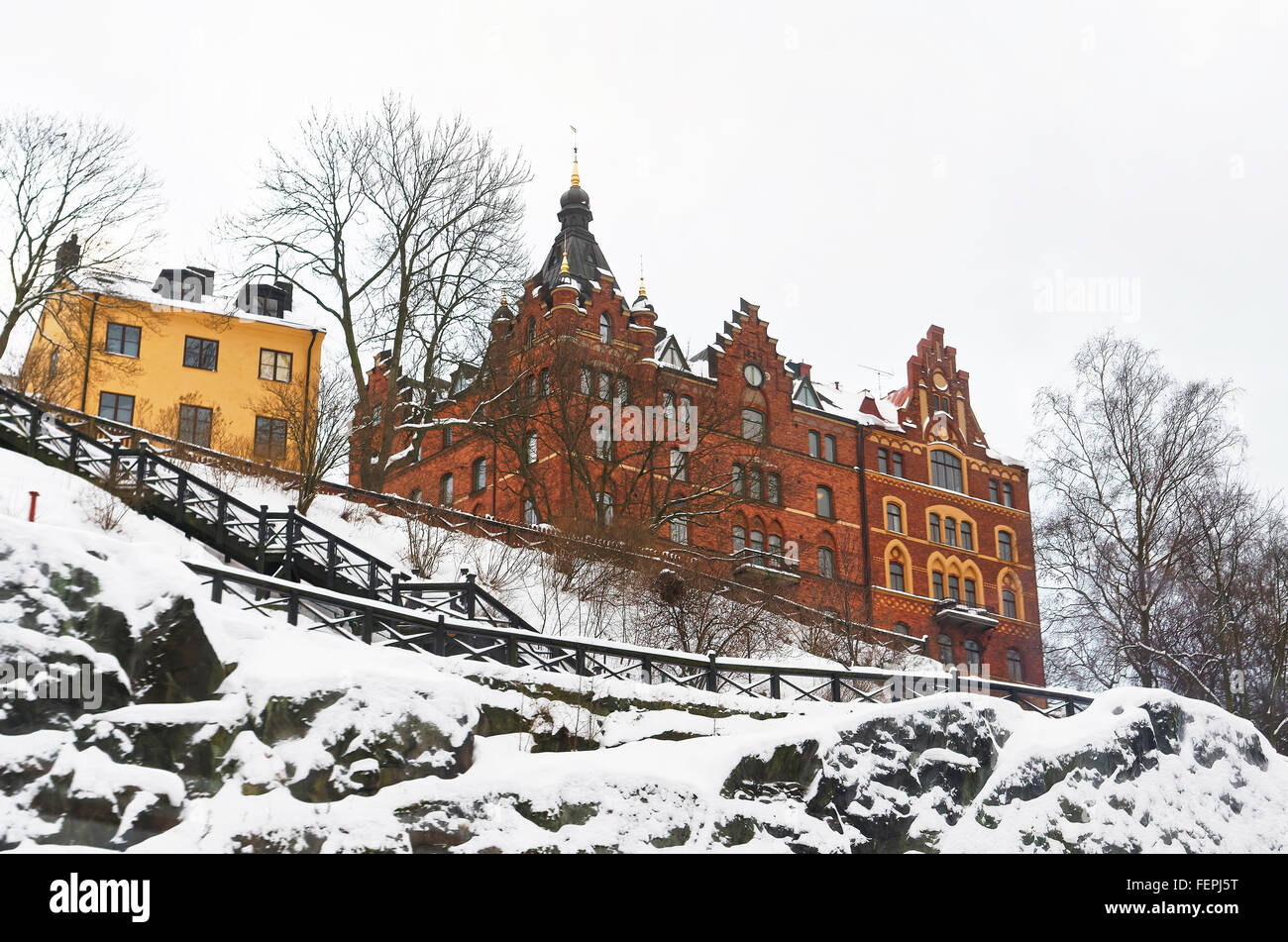 Red brick house on the rock in winter Stockholm, Sweden. Stockholm is ...