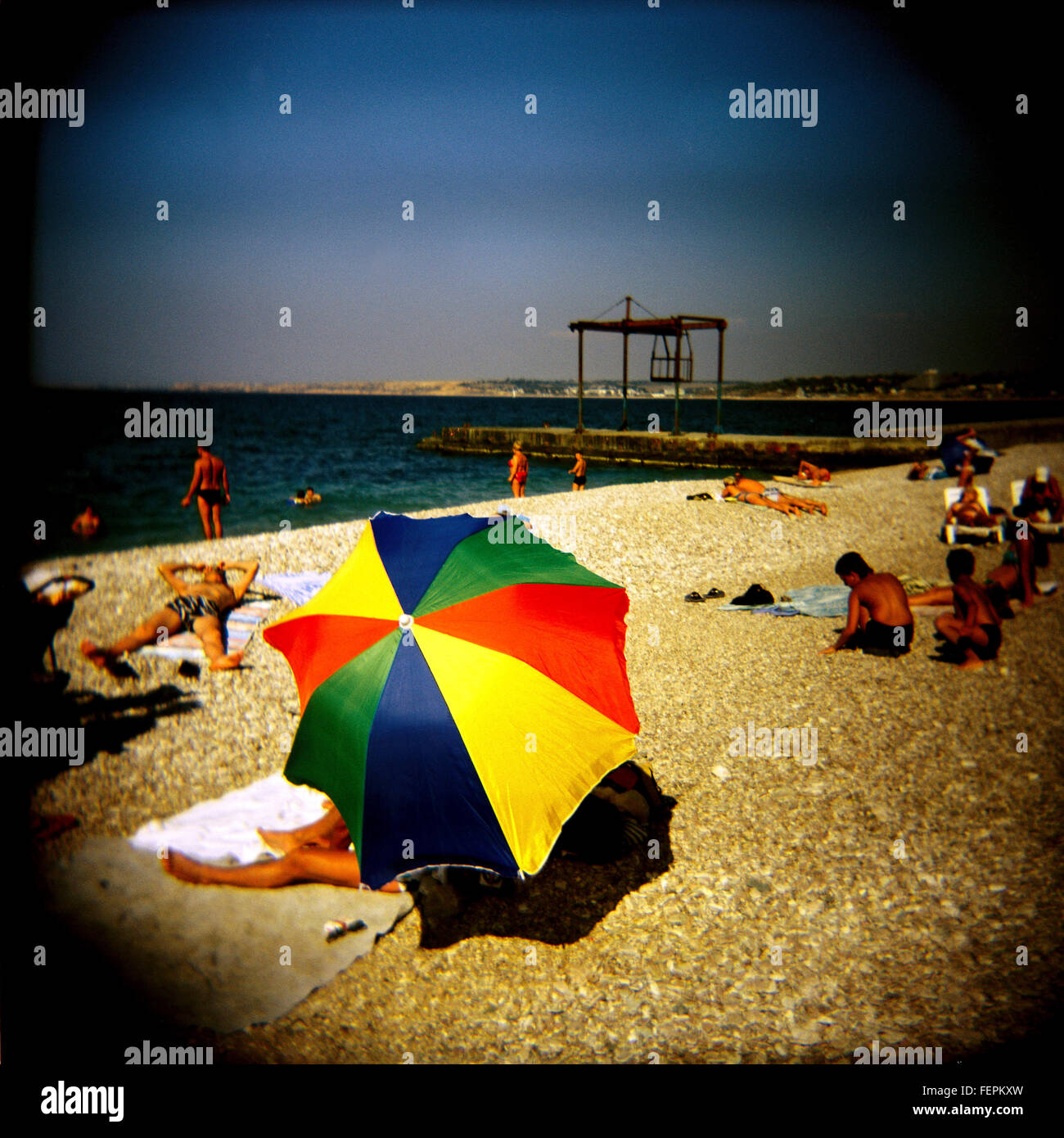 Group Of People Relaxing On Beach Stock Photo - Alamy