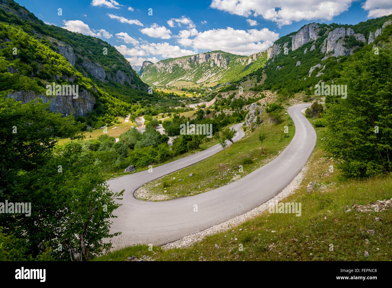 Curved mountain road Stock Photo - Alamy