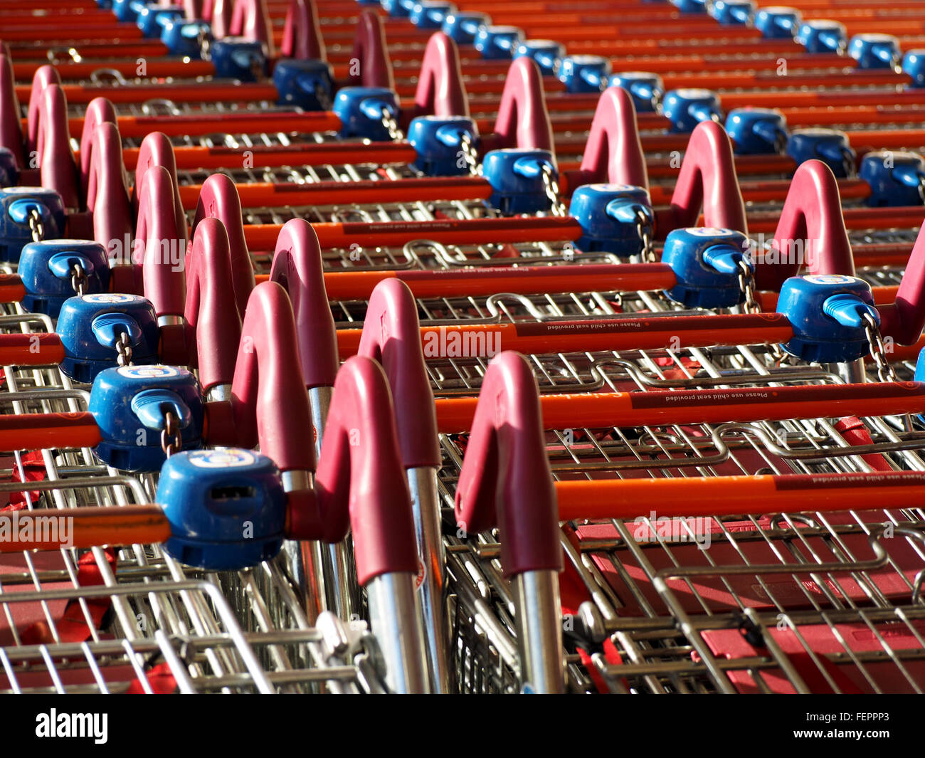 close-up of supermarket trolleys creating a strong graphic pattern of ...