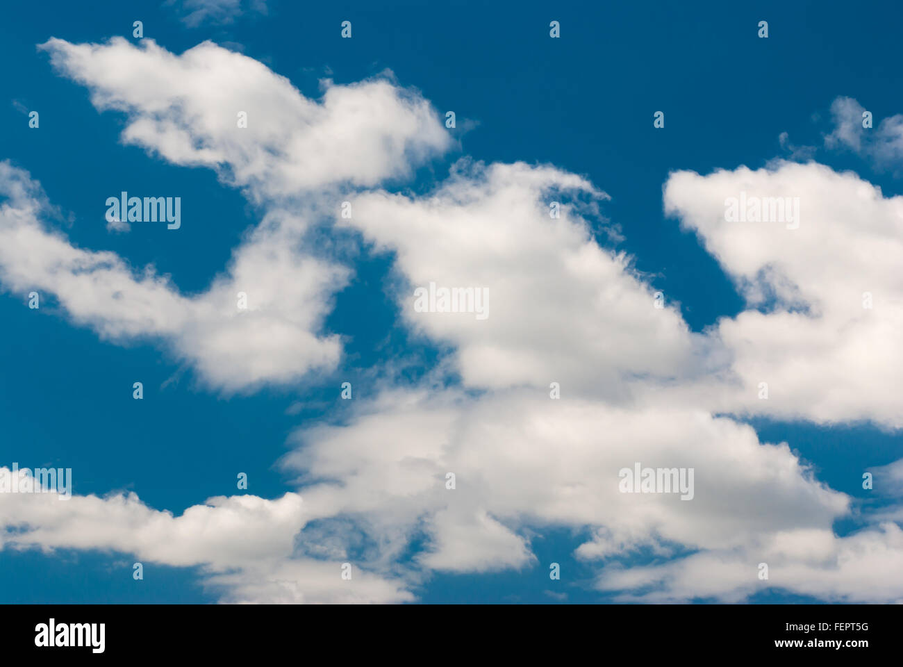 Beautiful blue sky with fluffy white clouds Stock Photo - Alamy