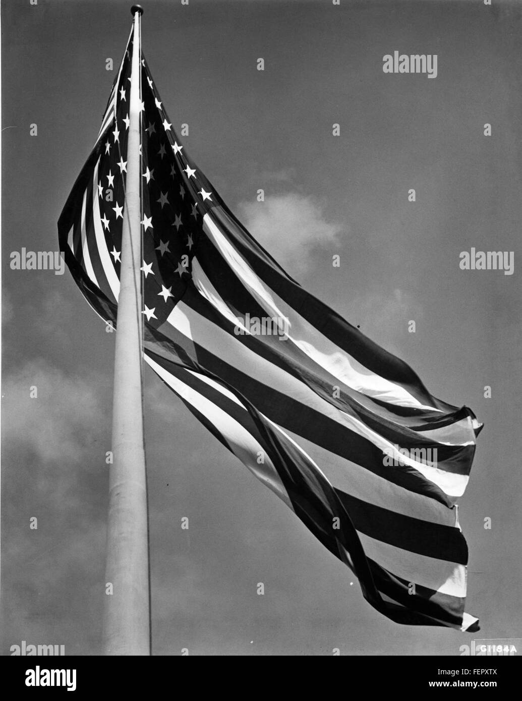 The image depicts the U.S. flag with an aircraft in the background ...