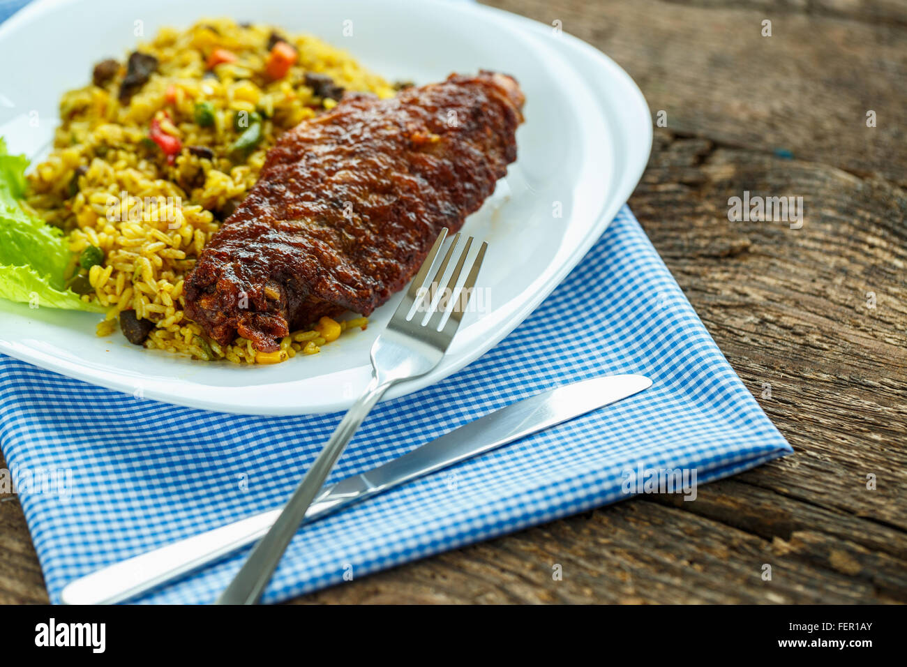 Tasty dish of turkey meat with rice and lettuce Stock Photo - Alamy