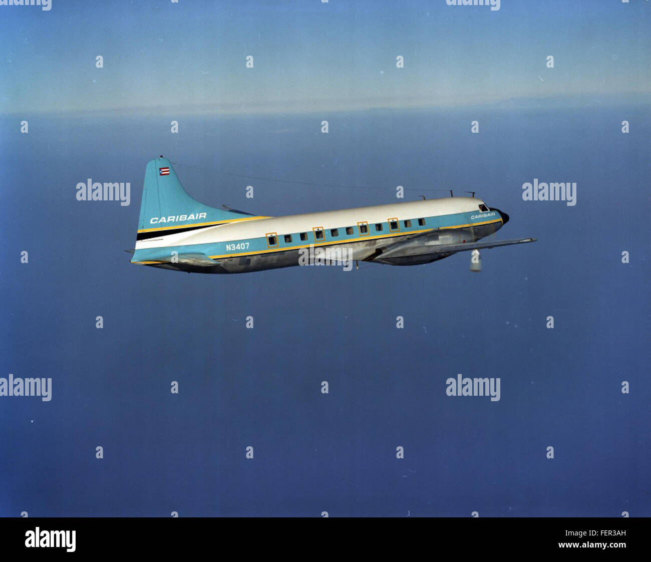 The Convair 640 N3407, operated by Caribair, is shown in flight on ...