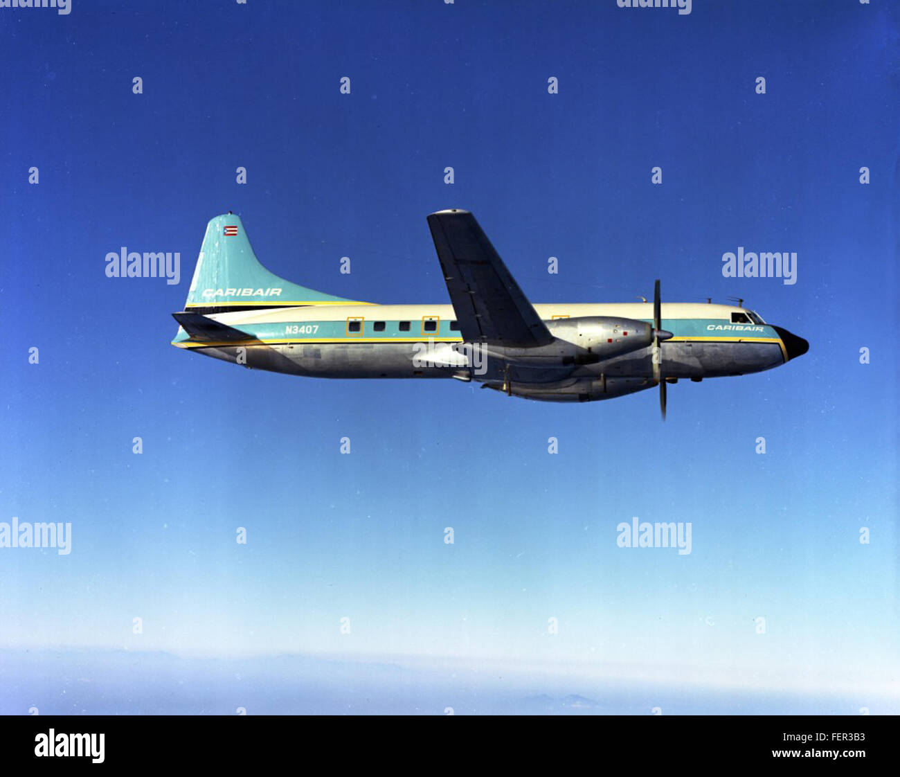 The Convair 640, registration N3407, operated by Caribair, is seen here ...