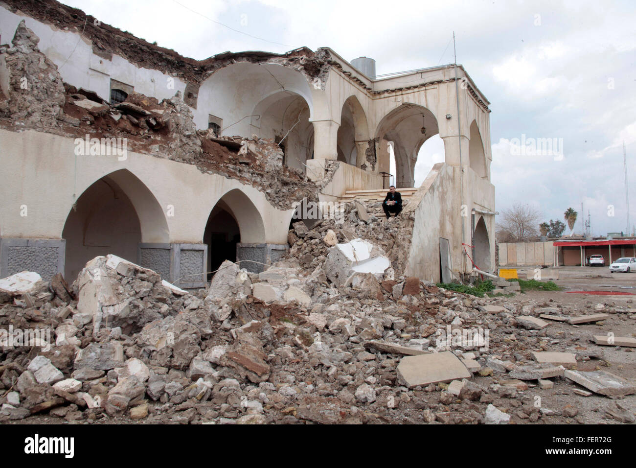 Kirkuk, Iraq. 8th Feb, 2016. A man inspects a significant breakdown in ...