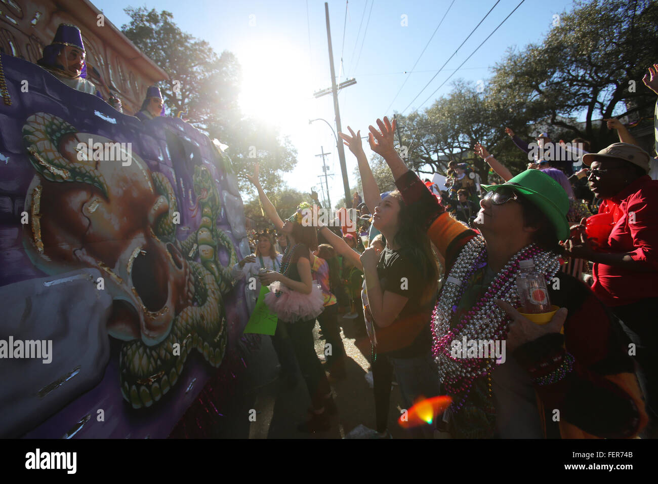 New Orleans, LOUISIANA, USA. 7th Feb, 2016. Beads are thrown from a ...