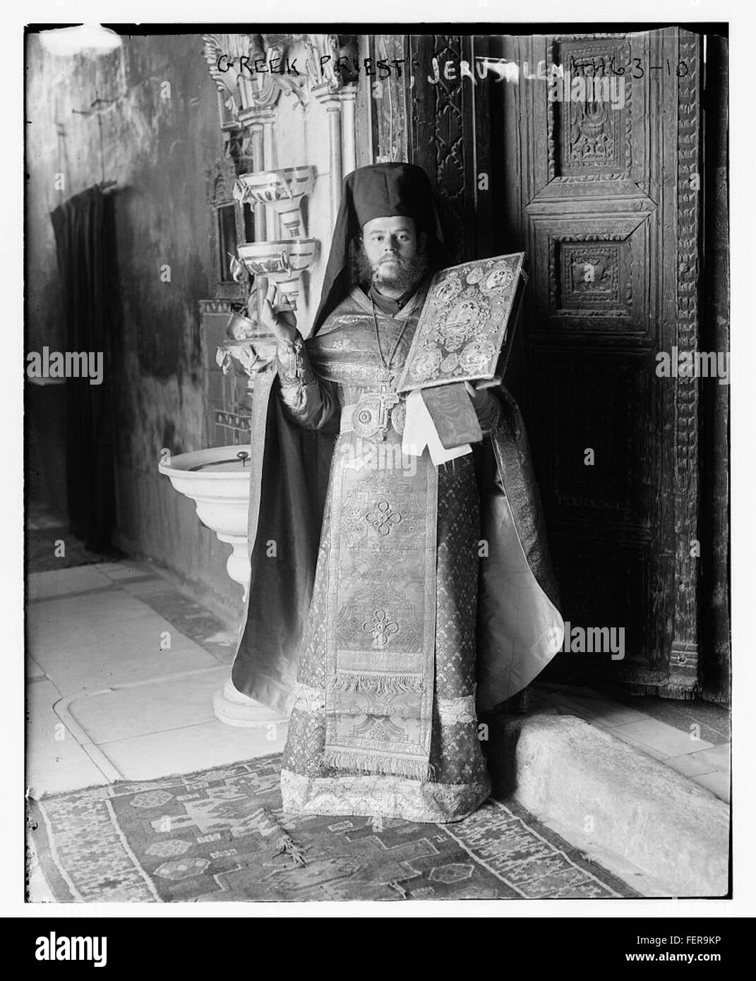 A Greek priest from Jerusalem is depicted in this photograph ...