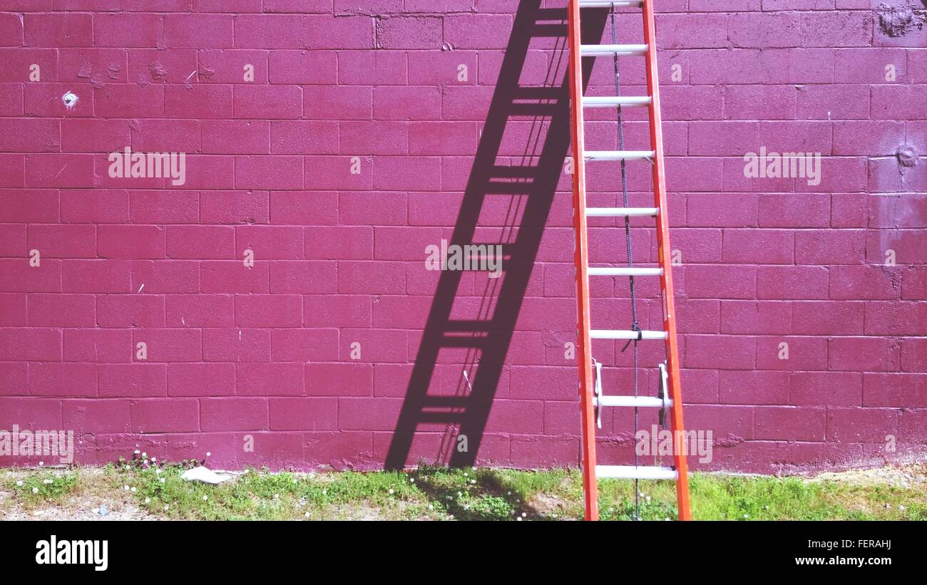 Ladder Leaning Against Brick Wall High Resolution Stock Photography and ...