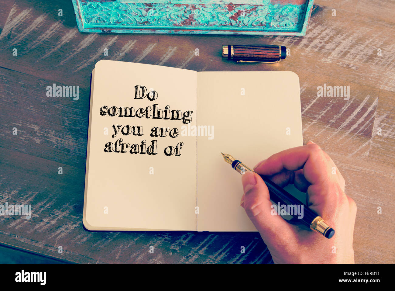 Retro effect and toned image of a woman hand writing a note with a ...