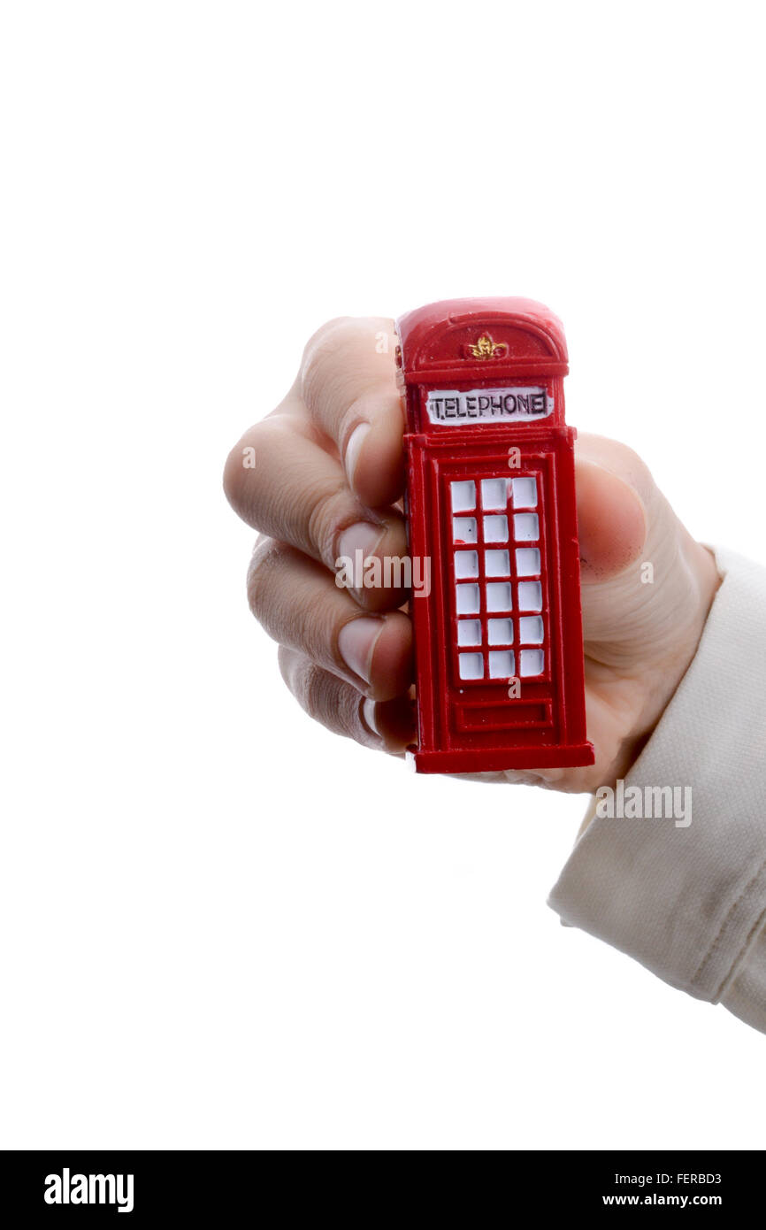 Hand holding English styled telephone booth Stock Photo - Alamy