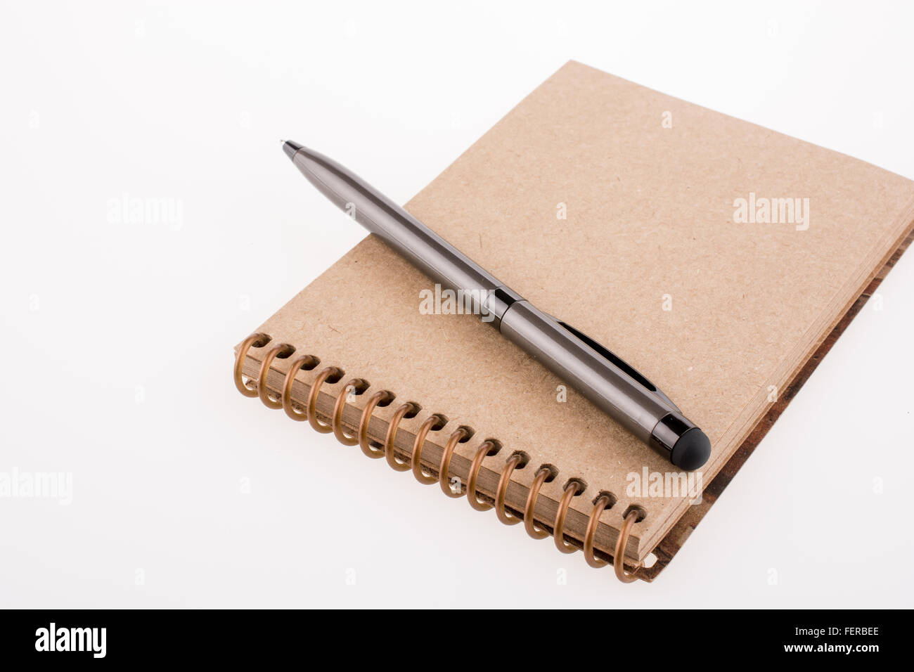 Spiral notebook and ballpoint pen on a white background Stock Photo - Alamy