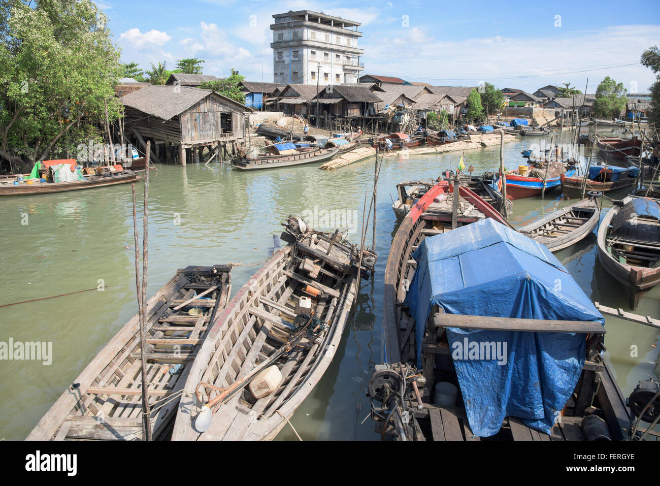 Traditional wooden boats on a canal in Myeik, Southern Myanmar Stock ...