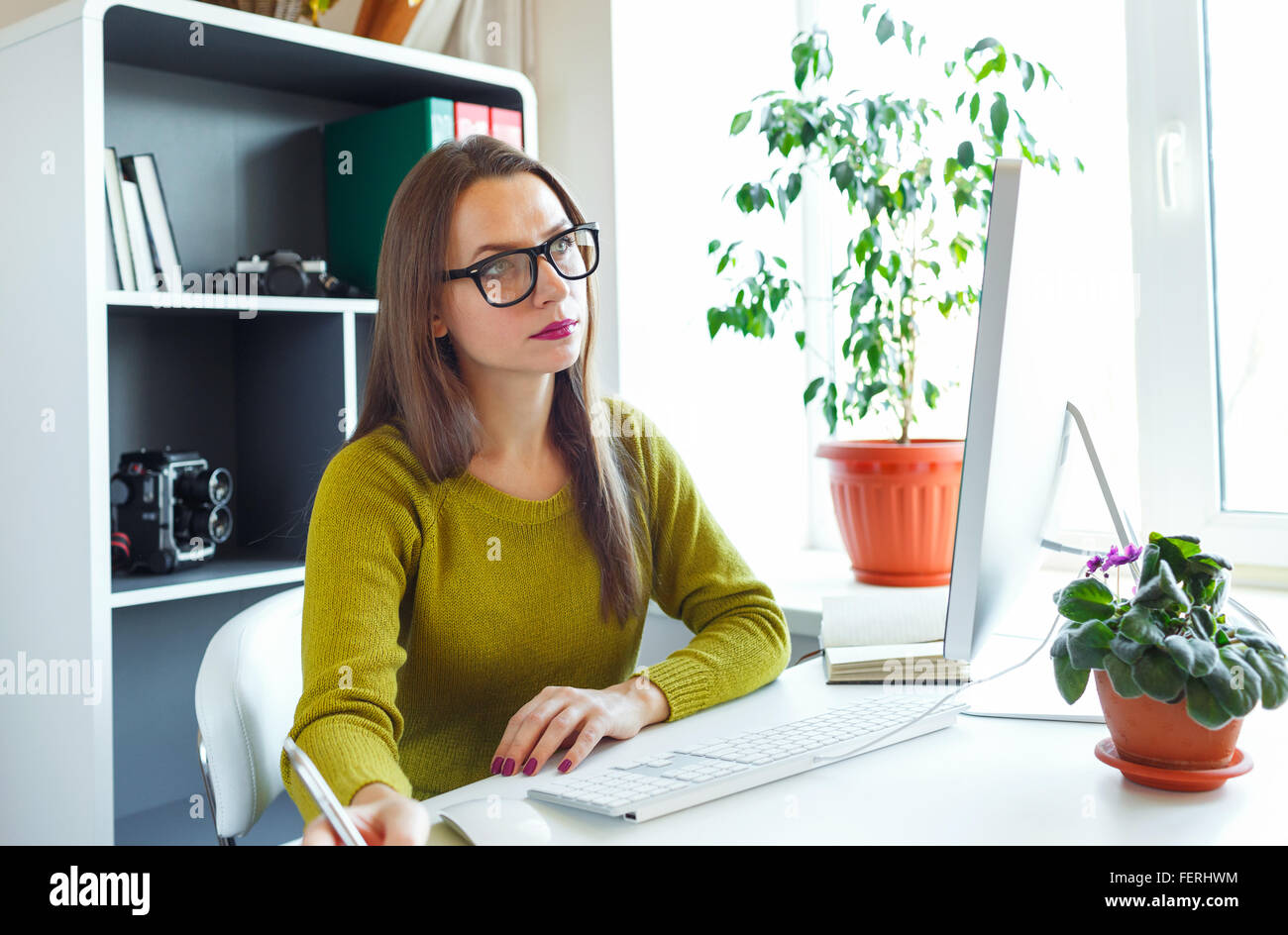 Beautiful young woman working from home - modern business concept Stock ...