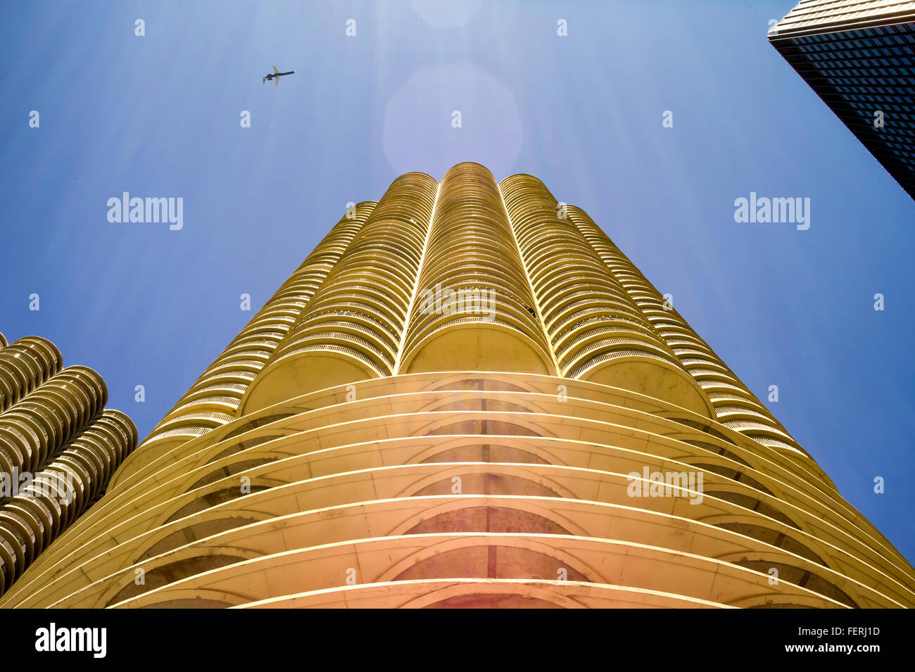 Airplane crossing a building Stock Photo - Alamy