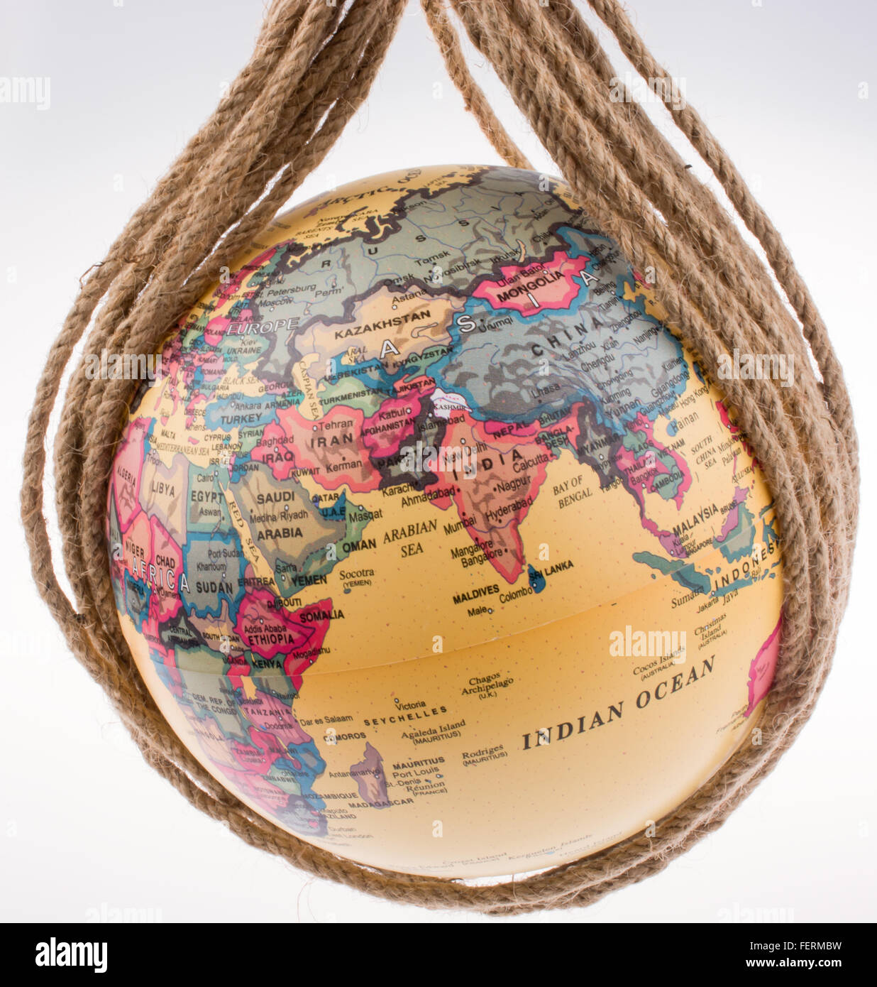 globe hanging in rope on white background Stock Photo - Alamy