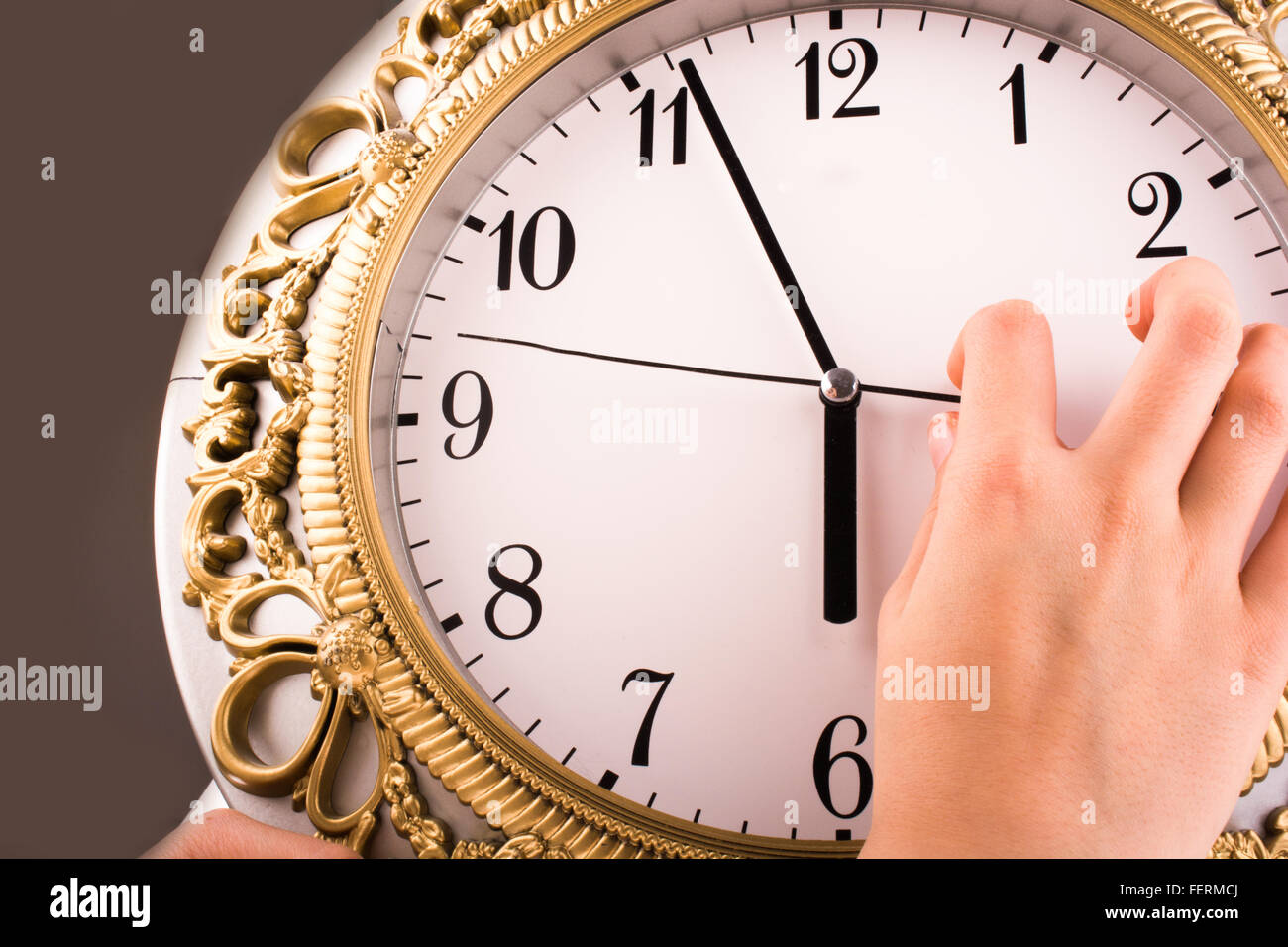 hand in touch with a clock on a white background Stock Photo - Alamy