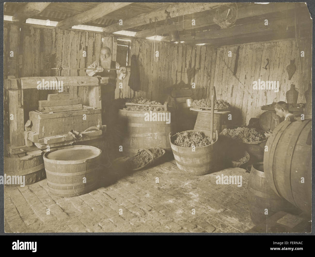 This photograph from around 1900 shows a man operating a traditional ...