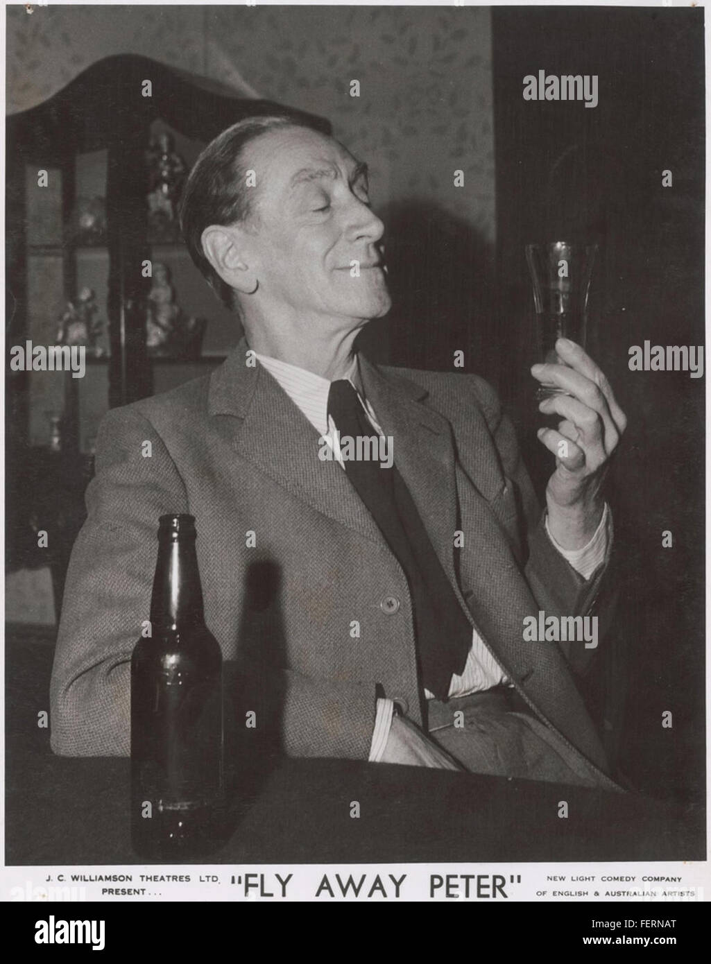J H Roberts, an actor, is seen drinking beer during a production by JC ...