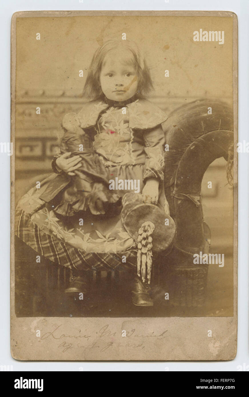 A portrait of 2-year-old Lorrie McDaniel with her dolls. The image ...