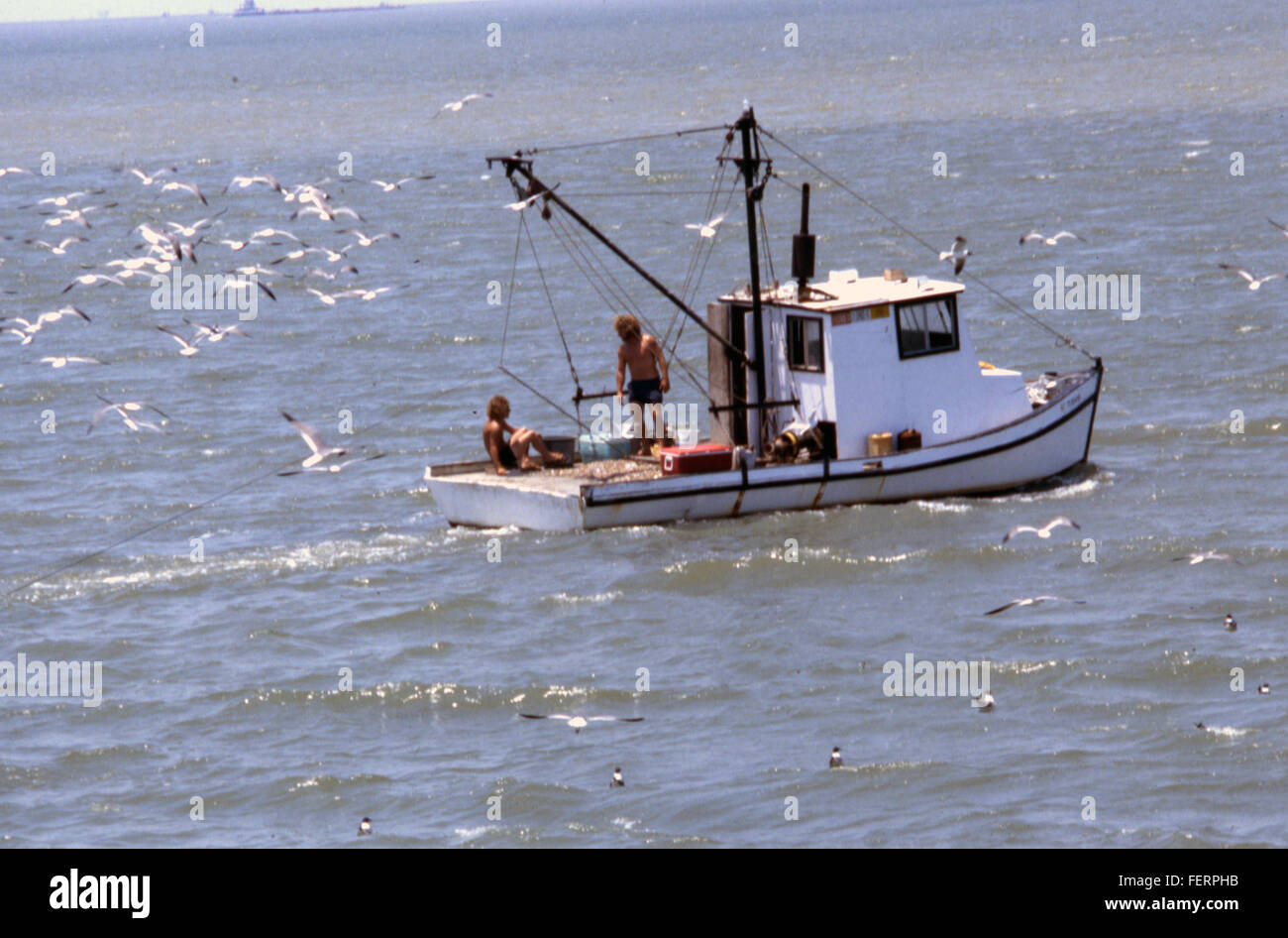 A photograph of a shrimp boat docked in Galveston, Texas, in 1978 ...