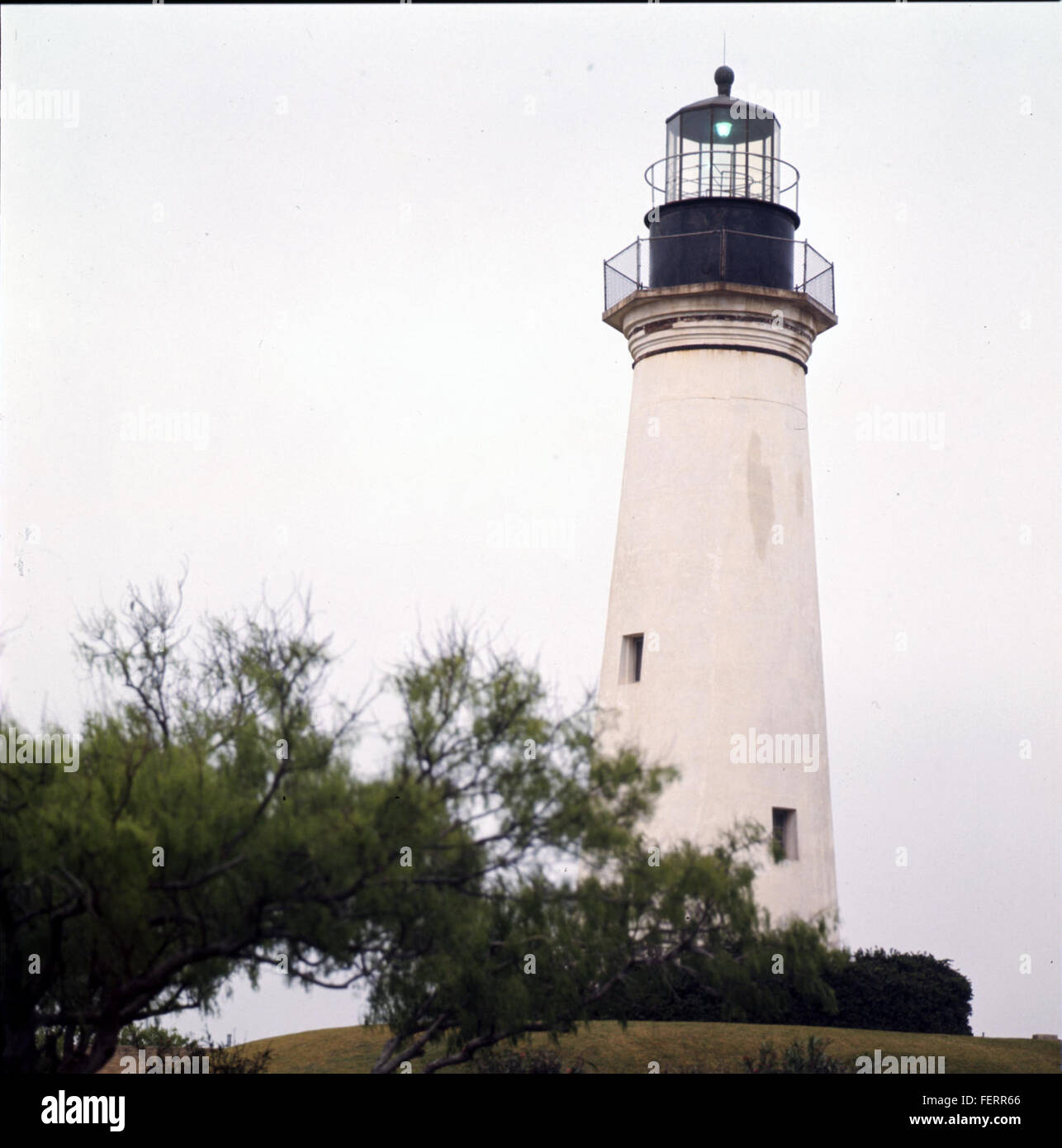 This photograph captures a lighthouse, an essential structure for ...