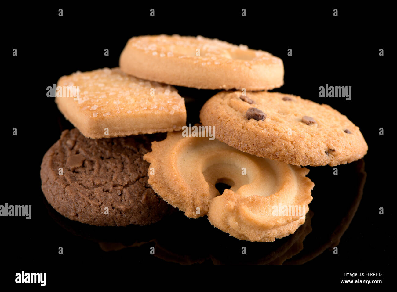 Butter cookies isolated on black background. Closeup Stock Photo - Alamy