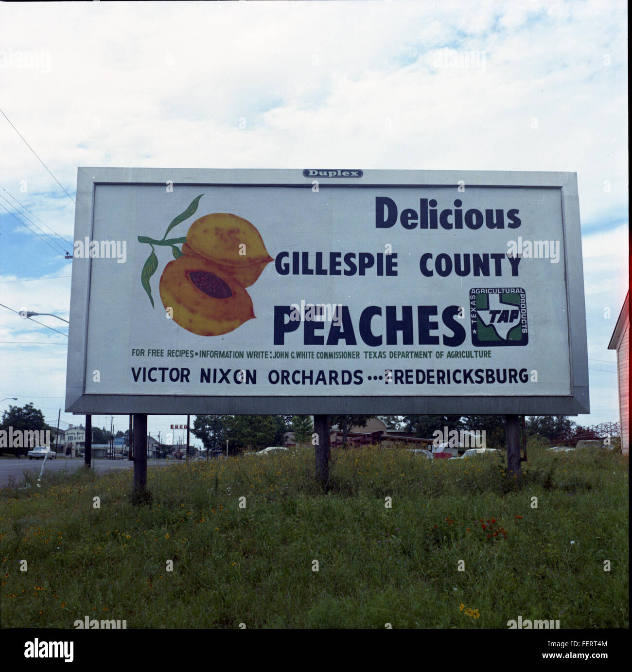 Billboards promoting peaches, watermelons, and beef serve as ...