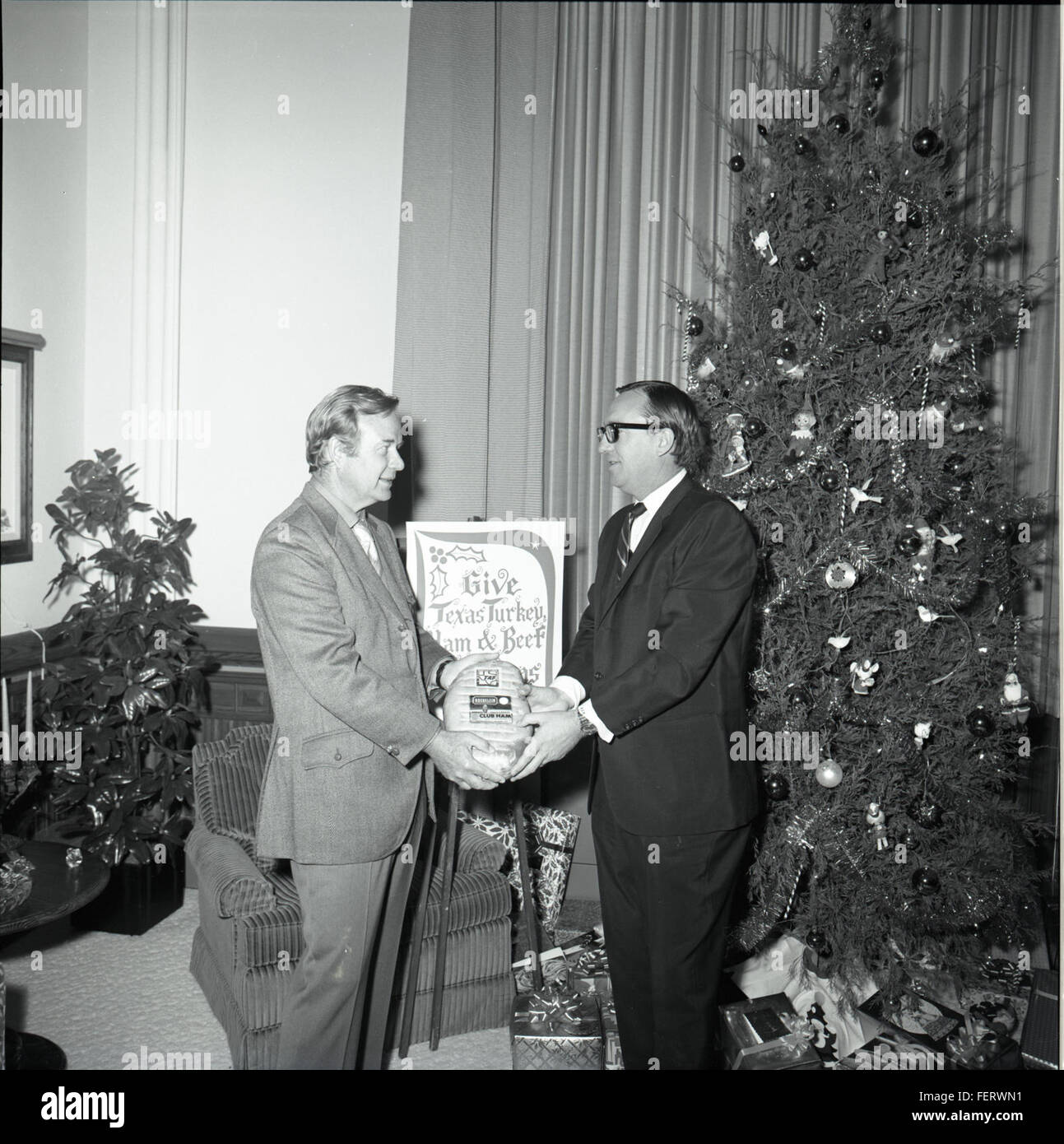 Commissioner John C. White is pictured presenting Christmas gift ...