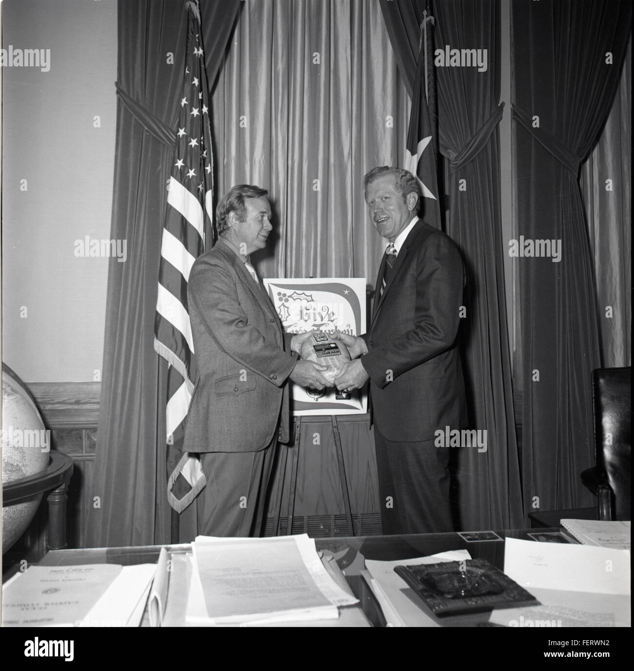A 1970 photograph of Commissioner John C. White presenting Christmas ...