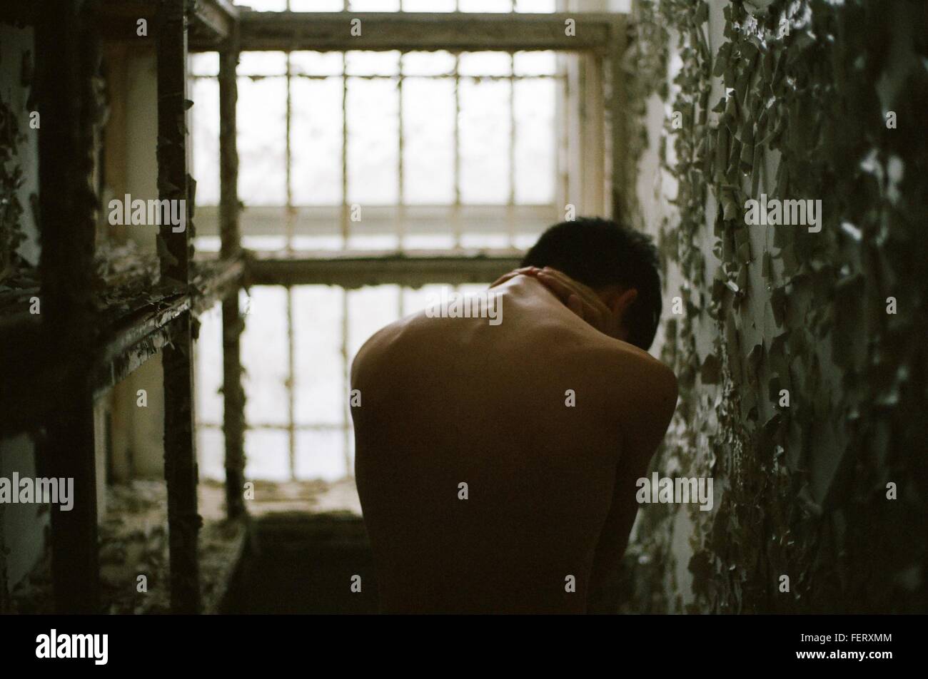 Rear View Of Man Holding Hands On His Neck Stock Photo - Alamy