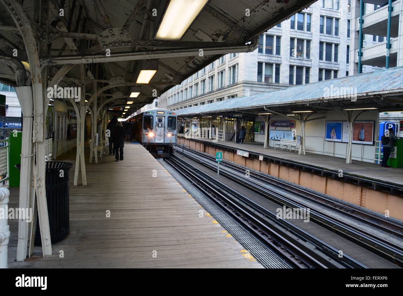 A Brown Line commuter train pulls into the "L" Station at Randolph and ...