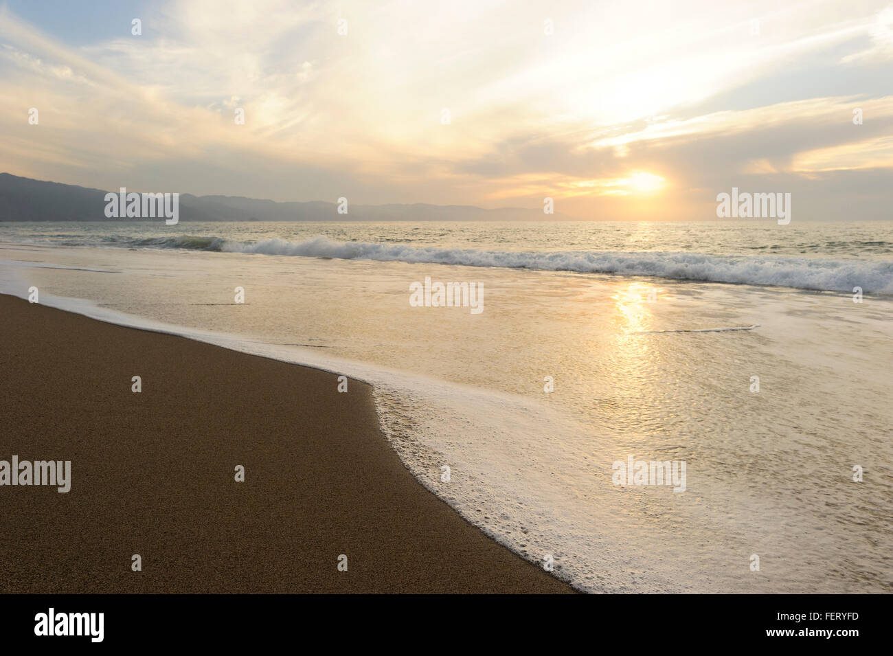 Ocean sunset is a brightly lit golden seascape with a gentle wave ...