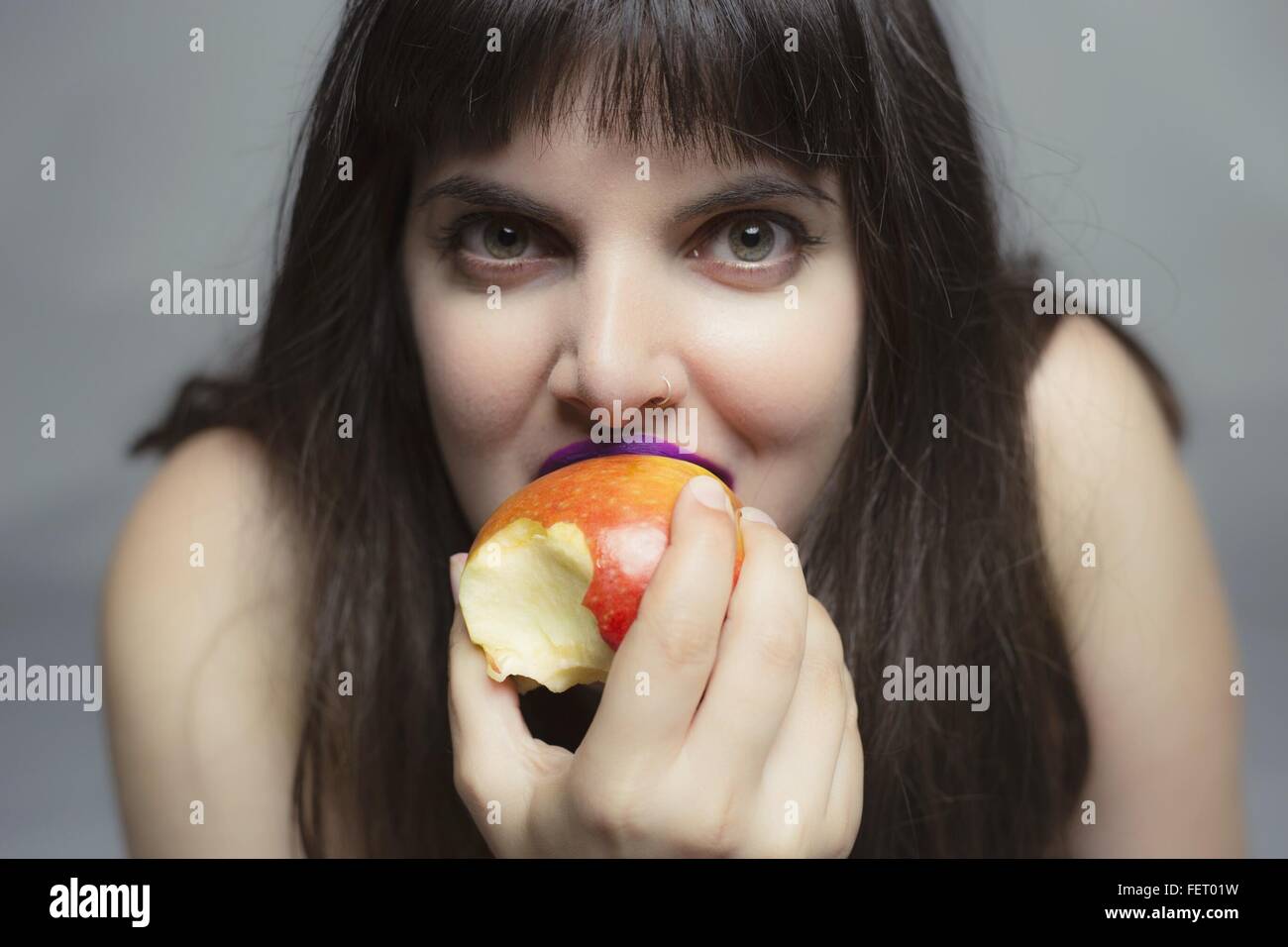 Black woman eating fruit hi-res stock photography and images - Alamy
