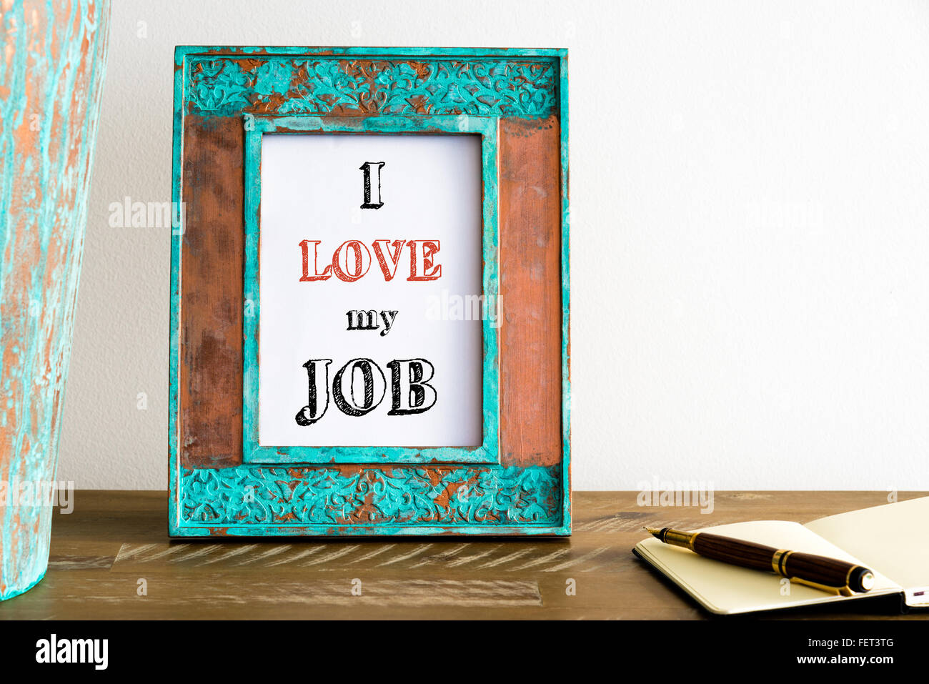 Vintage photo frame on wooden table over white wall background with ...