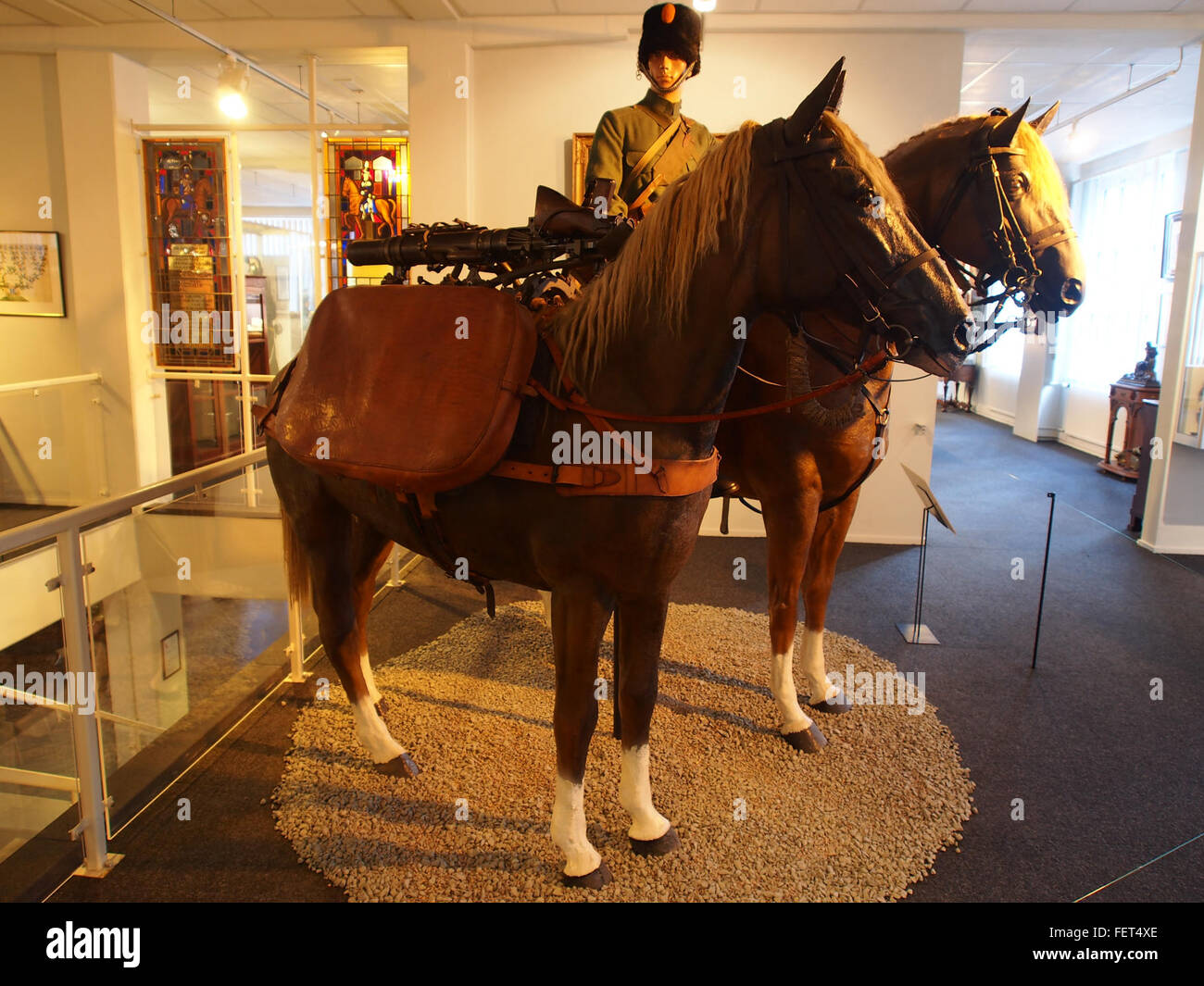 The image shows a horse-mounted machine gun setup with a Lewis machine ...