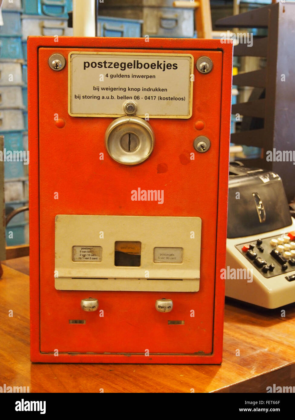 An antique postage stamp book dispenser, showcasing the design and ...