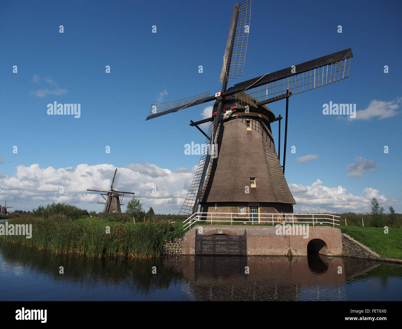A Dutch windmill at Kinderdijk, Netherlands, stands as a symbol of ...
