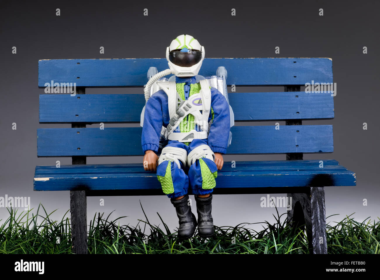 Rocket man on a blue park bench Stock Photo - Alamy