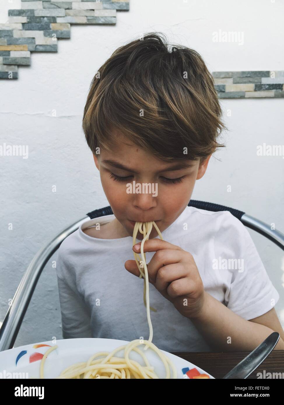Boy eating spaghetti hi-res stock photography and images - Alamy