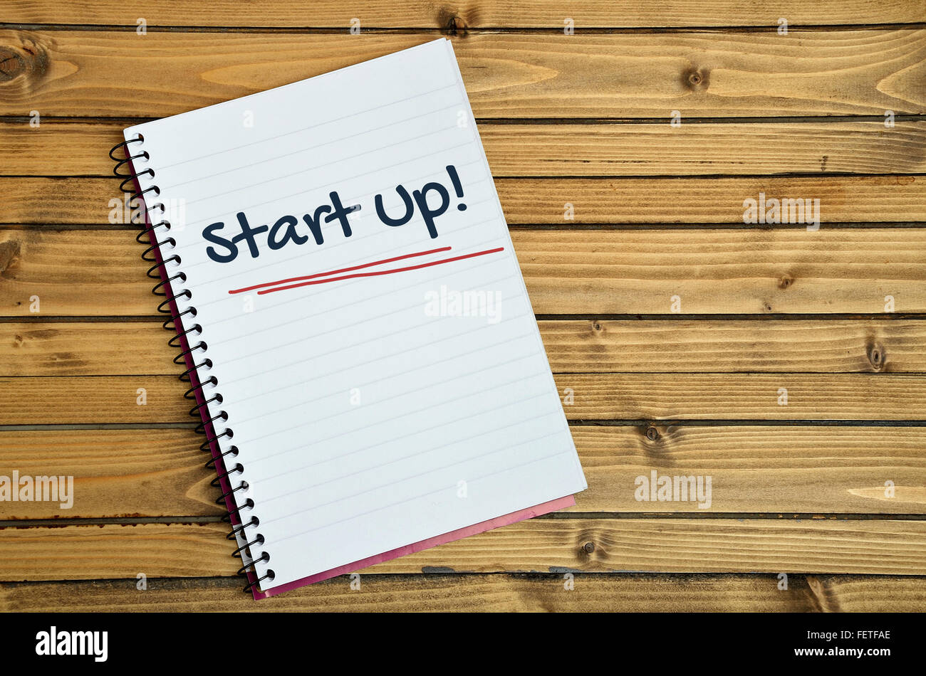 Start up word written on notebook page Stock Photo - Alamy