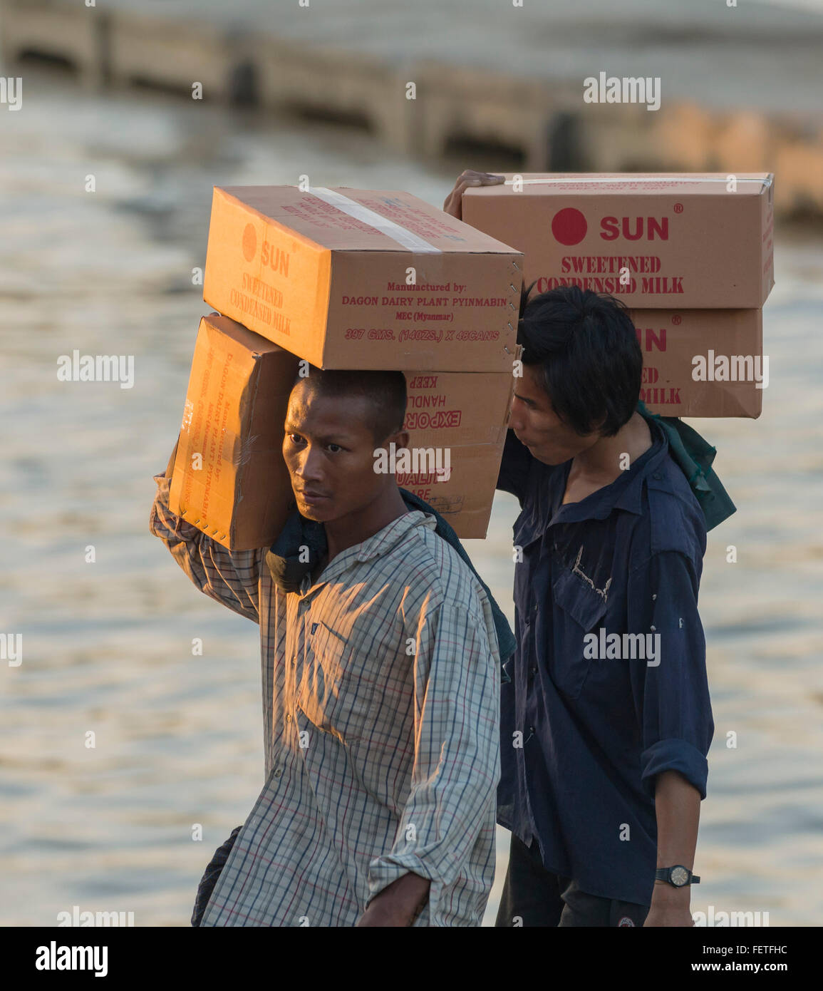 Carrying cargo onto a freight ship, Burma Stock Photo - Alamy