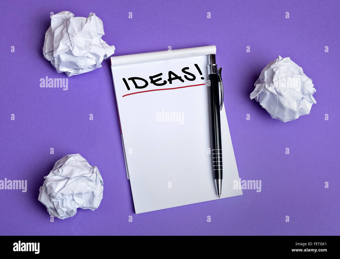 Ideas word on notepad on purple background Stock Photo - Alamy