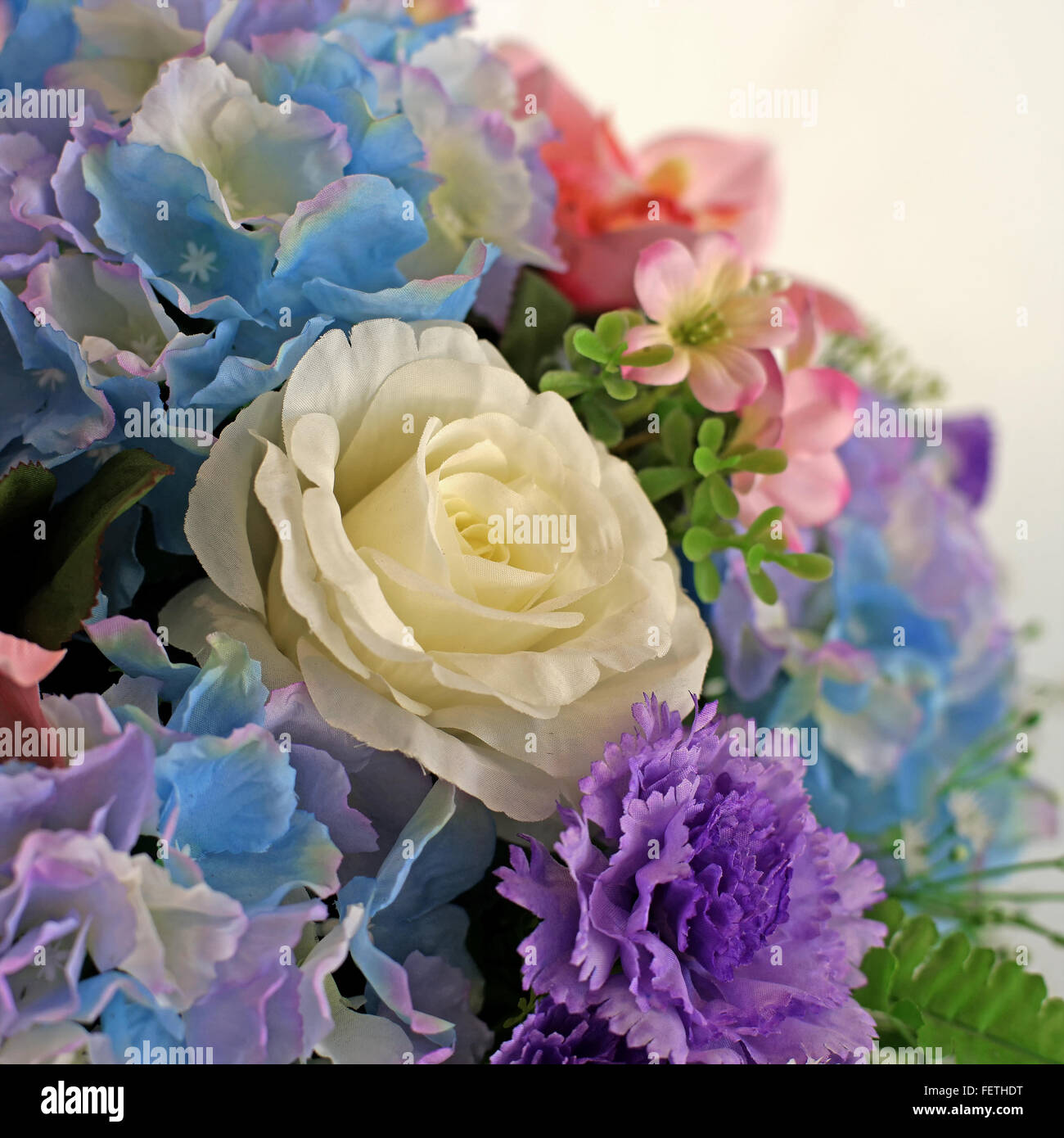 closeup of colorful rose artificial flower Stock Photo - Alamy