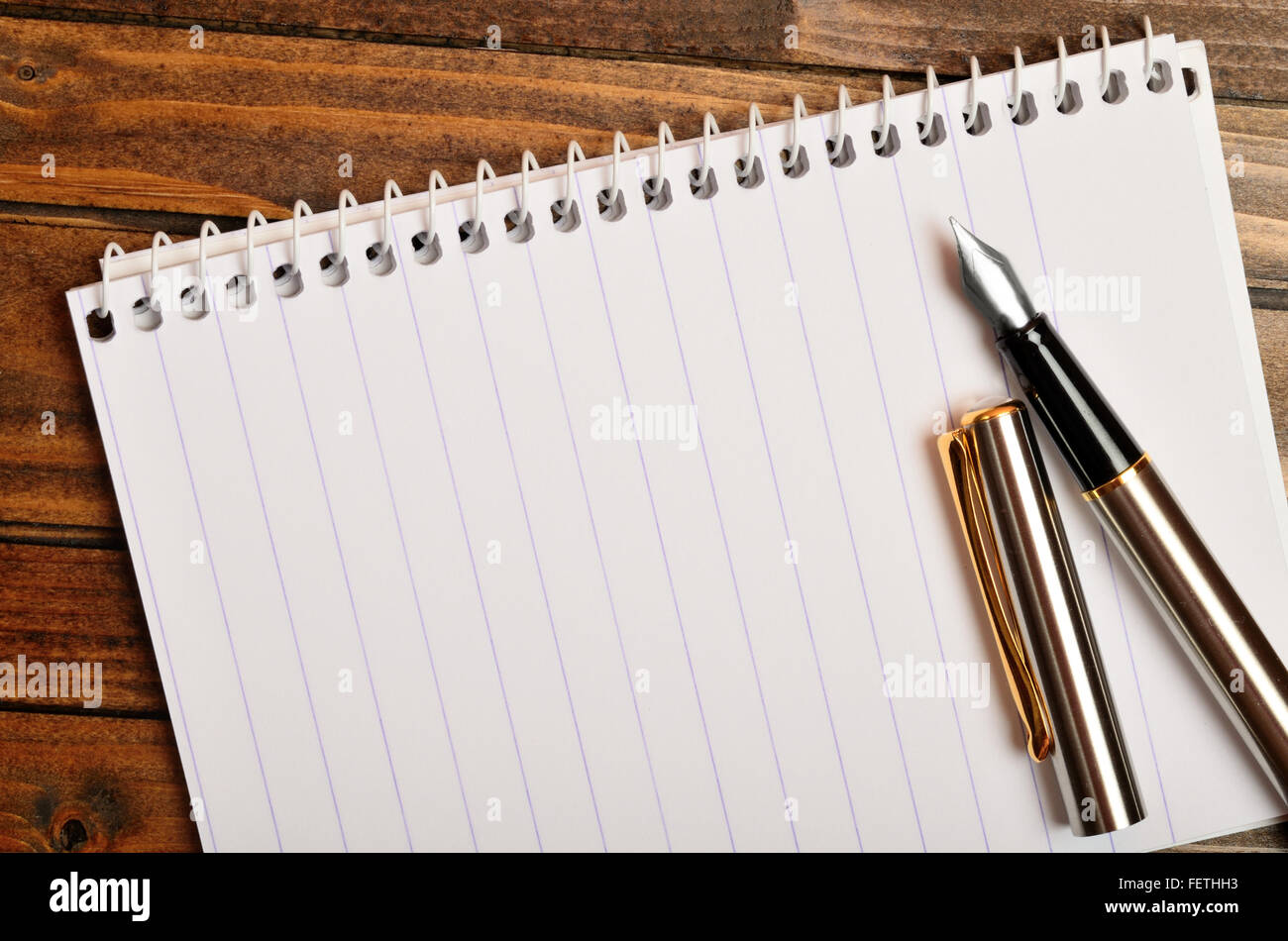 Empty notepad with fountain pen on wooden table Stock Photo - Alamy