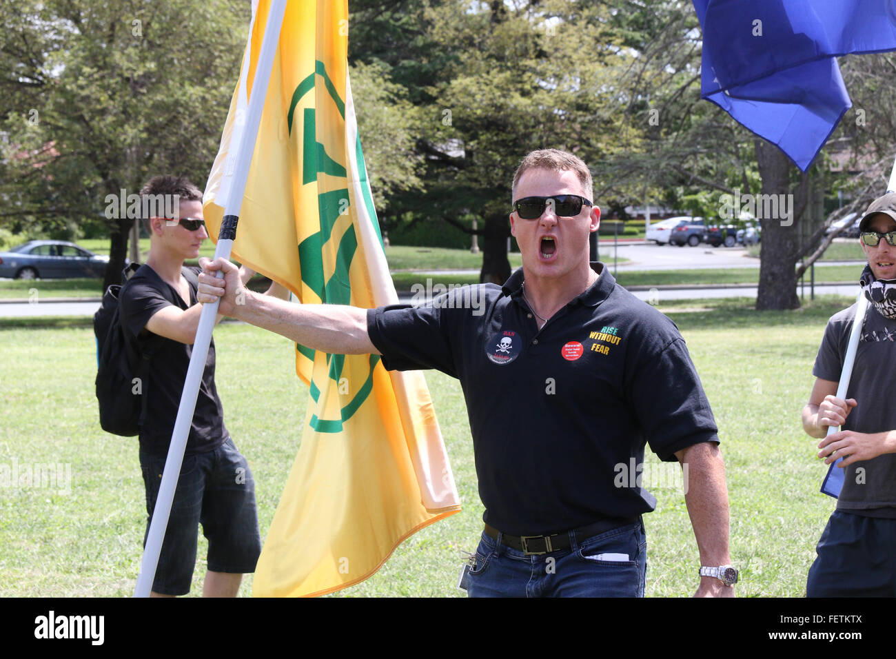 Chris Shortis from the United Patriots Front (UPF) holds the yellow ...