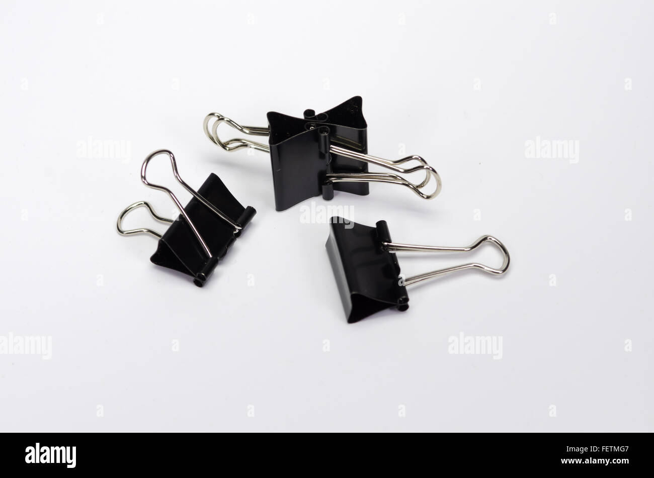 Black paper clip isolated on white background Stock Photo - Alamy